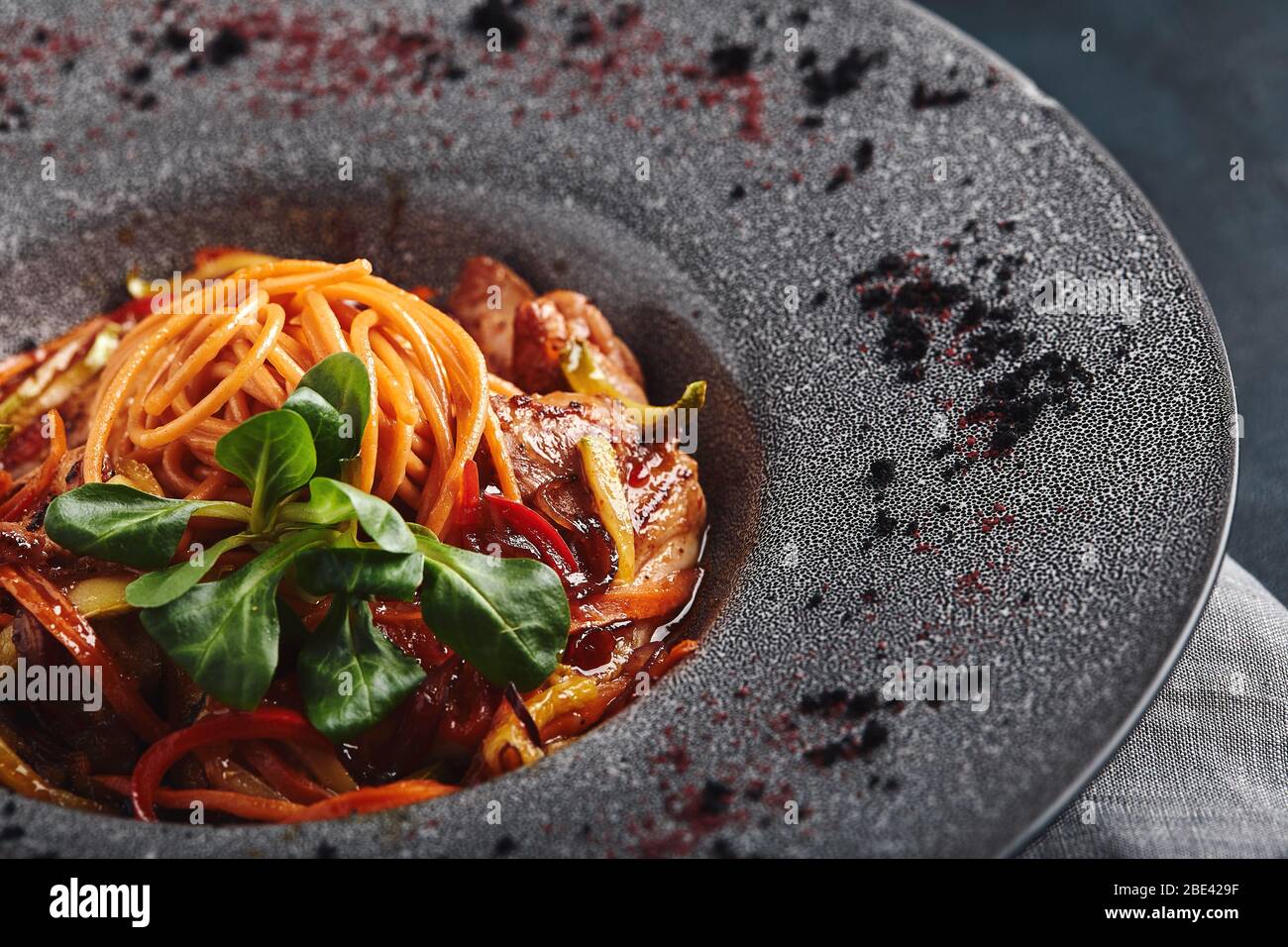 Spaghetti with vegetables tomato sauce and meat. Traditional italian ...