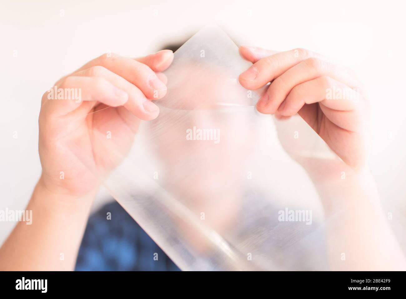 Man squaring the corners of an acetate. Process of making a homemade ...