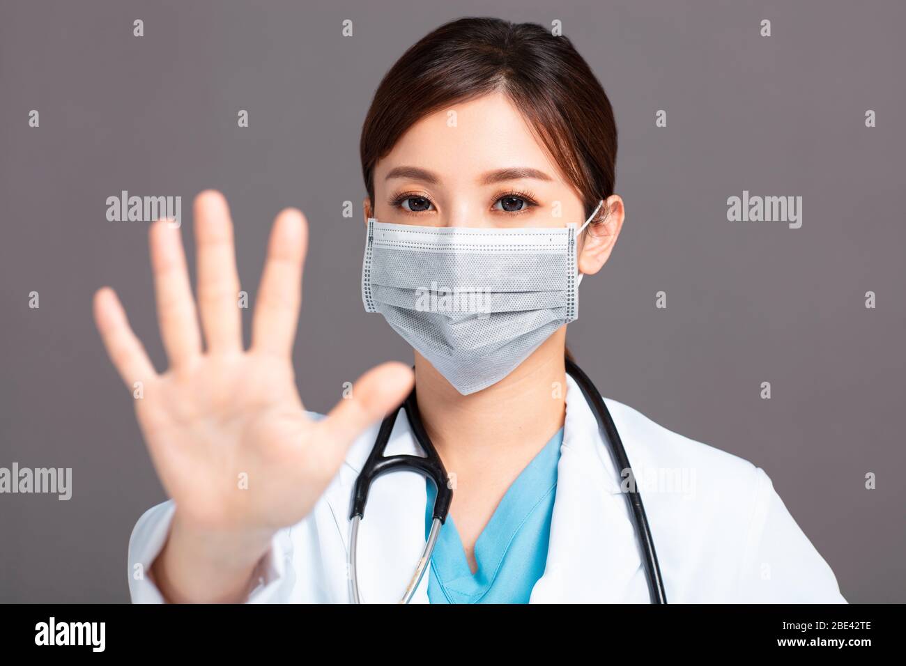 female doctor wearing face mask in prevention for coronavirus showing ...