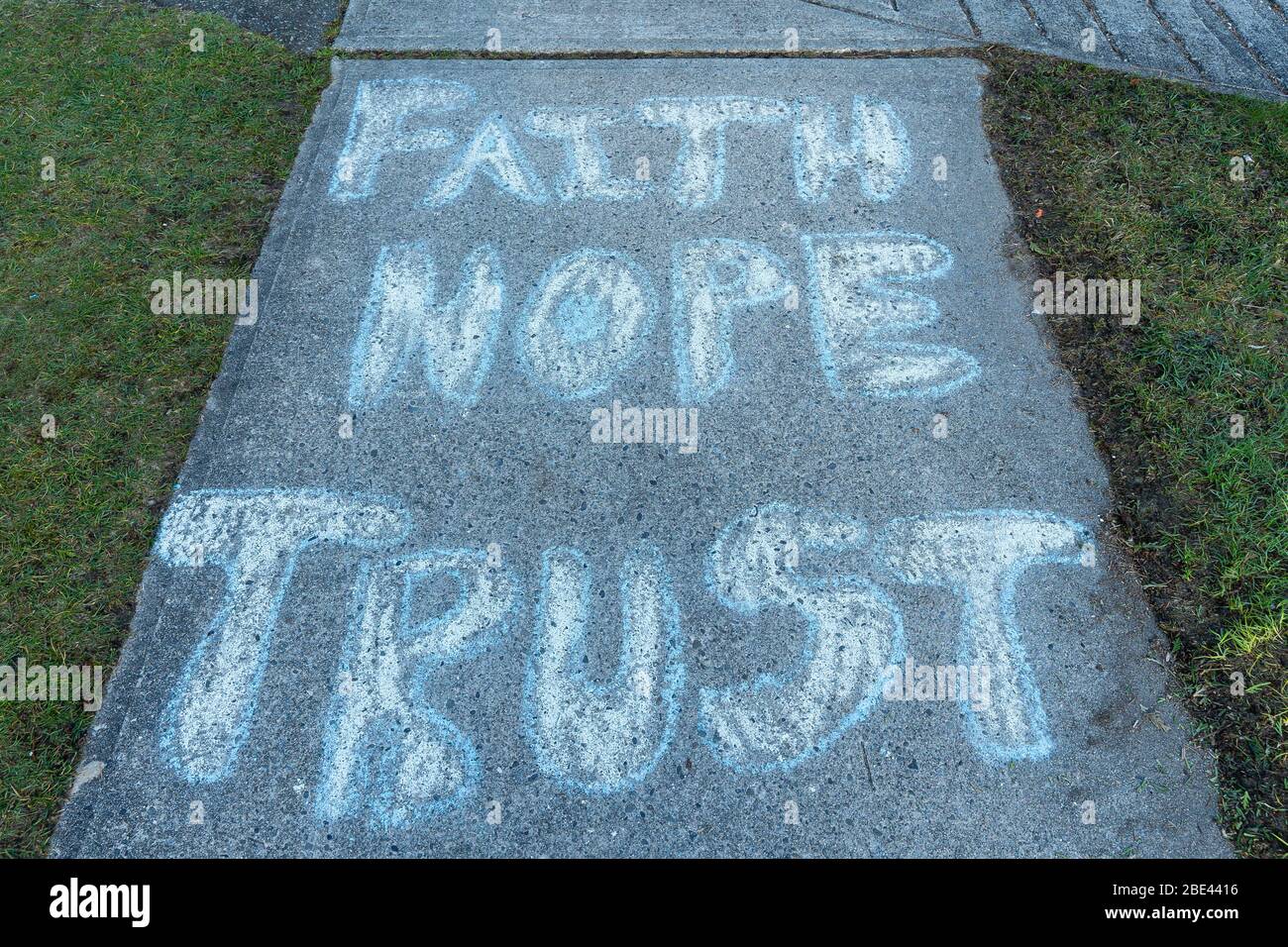 Uplifting chalk messages on the sidewalk made by children near the ...