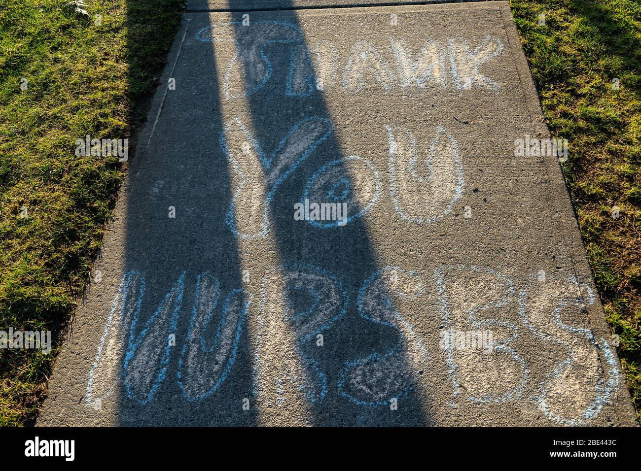 Uplifting chalk messages on the sidewalk made by children near the ...