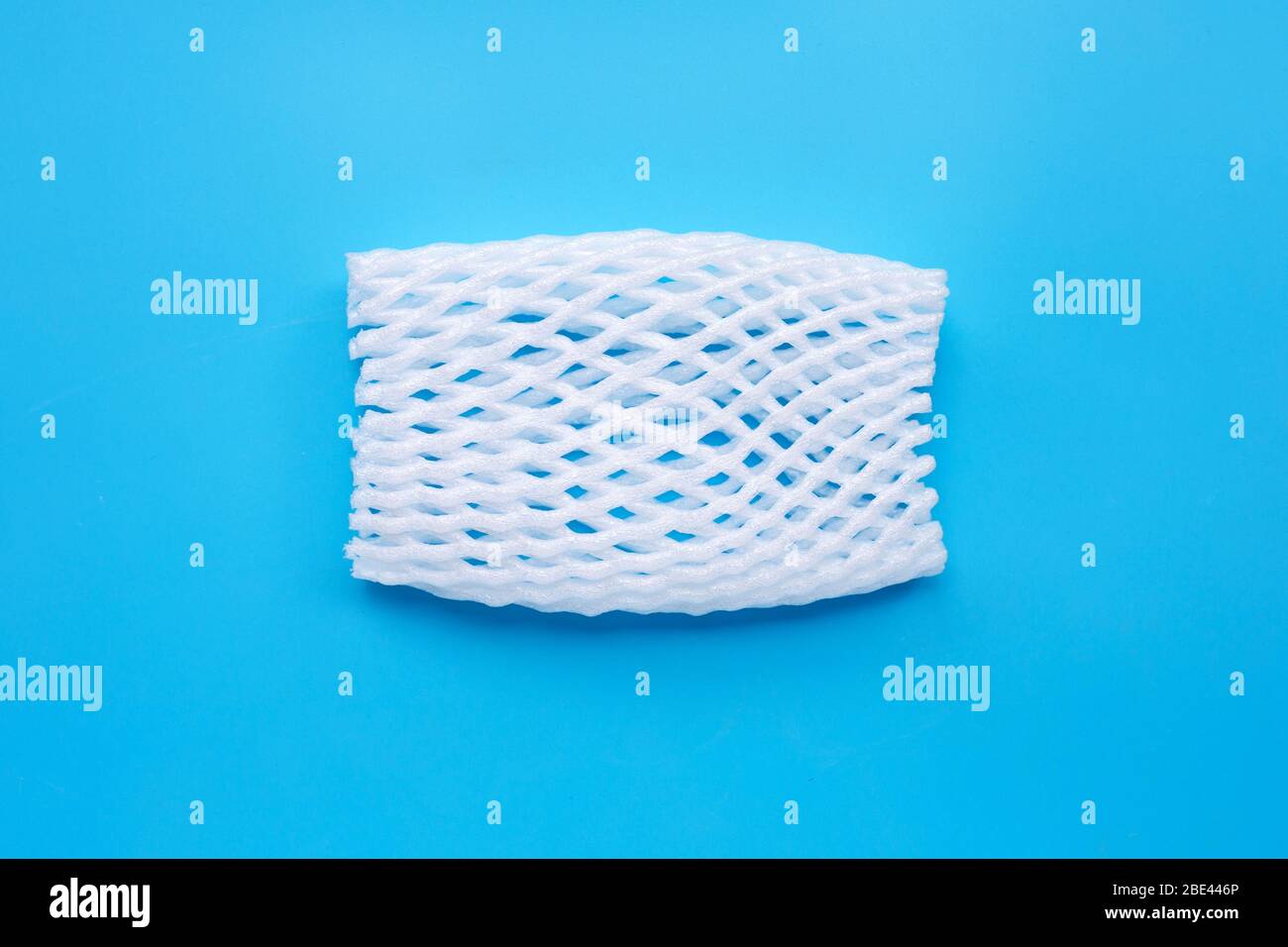 Fruit foam net for protection on blue background. Top view Stock Photo ...