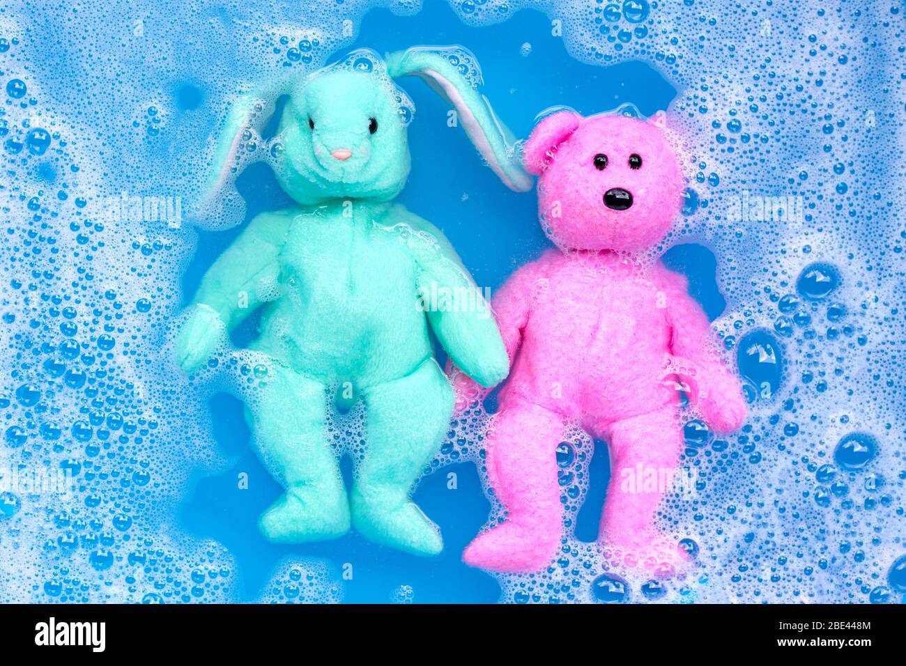 Soak rabbit doll with toy teddy bear in laundry detergent water ...