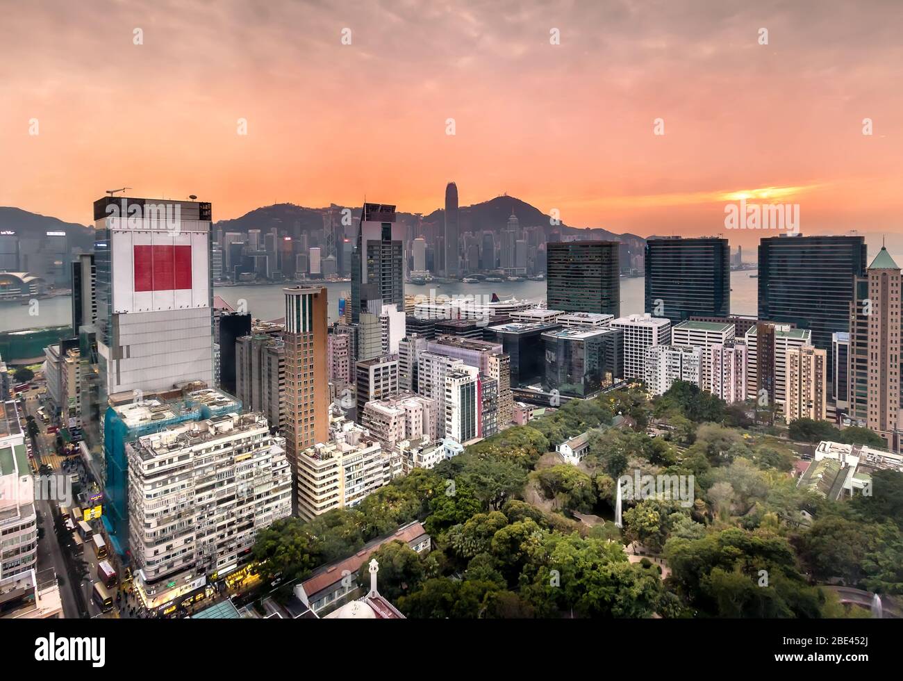Rooftop Panoramic View of Tsim Sha Tsui Skyline under a Vibrant Sunset in Kowloon, Hong Kong ...