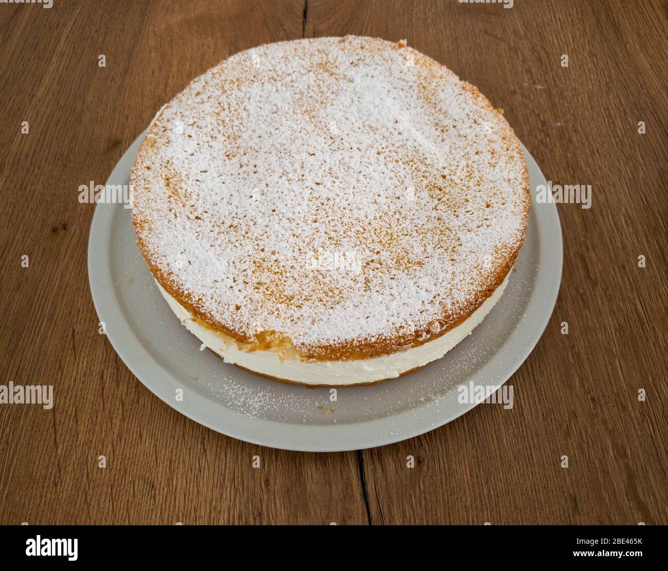 A complete, uncut delicious Cheesecake from a side view Stock Photo - Alamy
