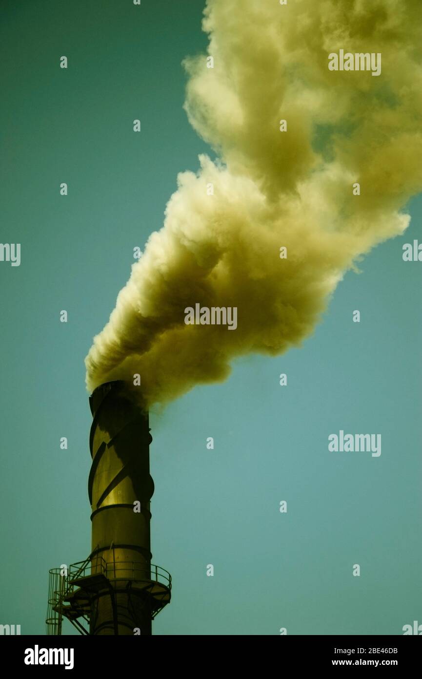 smoke stack polluting / with a cross processed effect / grungy grain ...