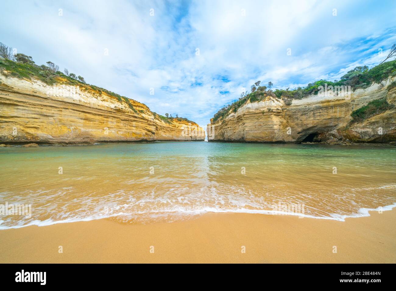 Protected bay in Loch Ard Gorge surrounded by high limestone walls and ...