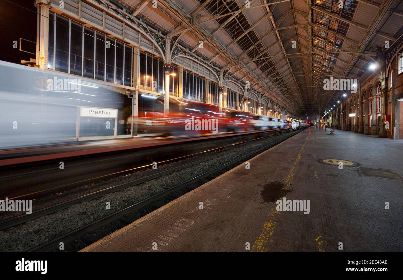 DB Cargo Rail UK freight train carrying new Ford cars and vans passing ...