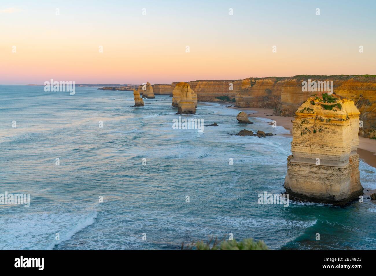 The Twelve Apostles at sunrise limestone stacks that attract tourists ...