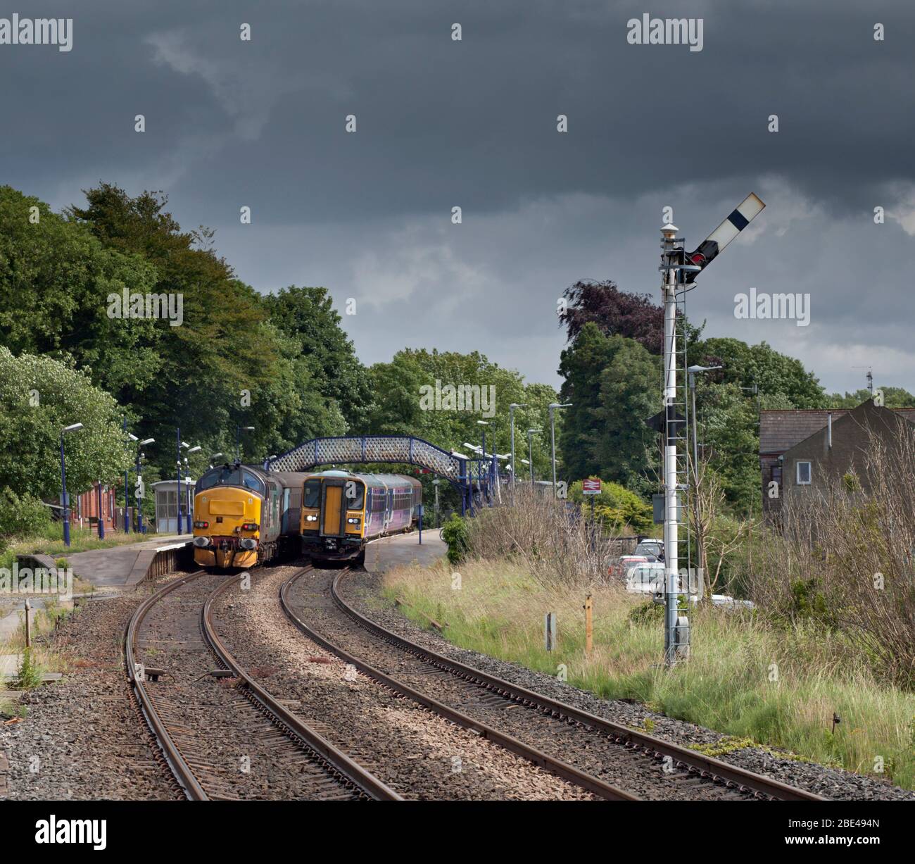 DRS class 37 locomotive and Northern rail class 153 at Arnside railway ...