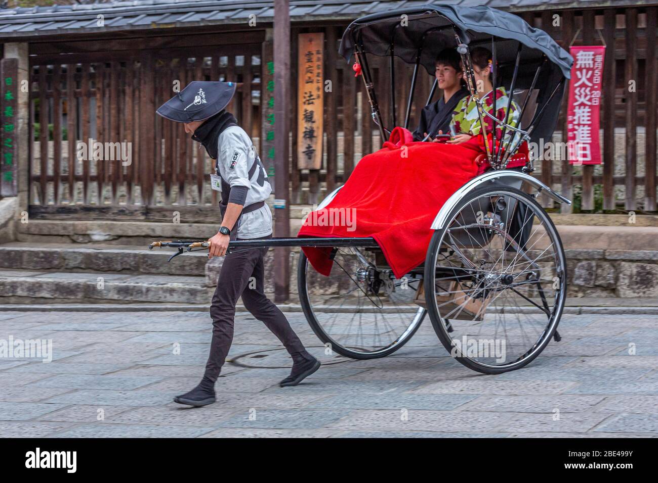 Rickshaw and young Japanese people in traditional Kimono Stock Photo ...