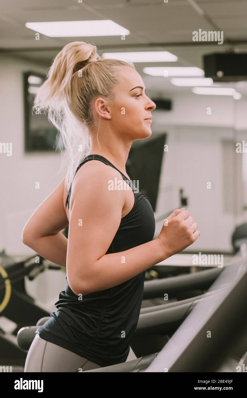 Young woman working out on a white background, from a complete series ...