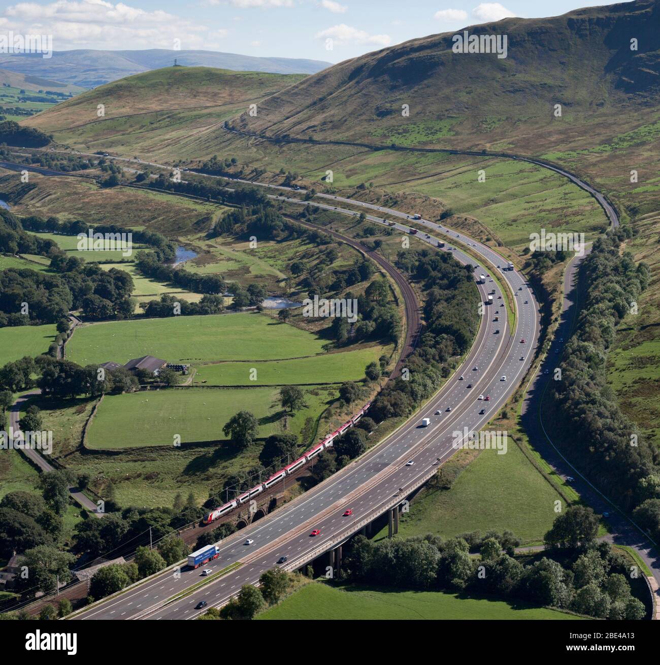 Virgin trains class 390 Alstom Pendolino train alongside the M6 ...