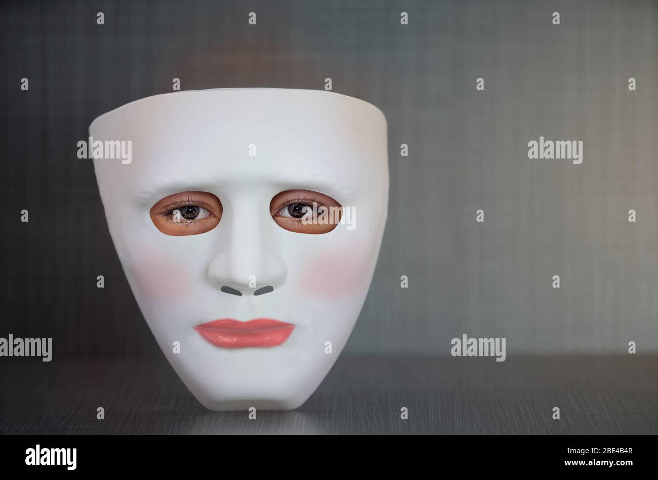 white plastic face mask with human eye,female Stock Photo - Alamy