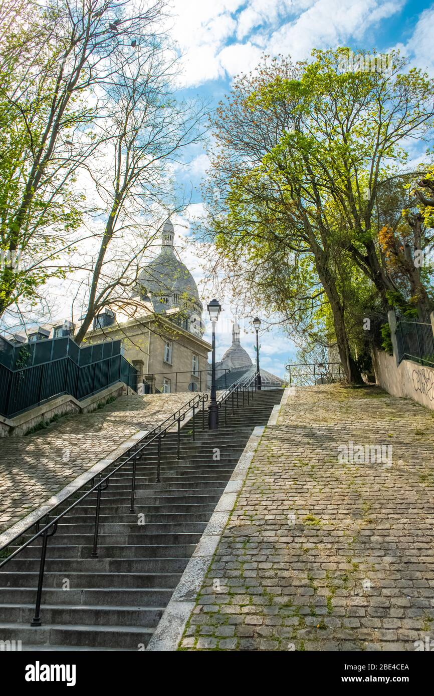 Paris, Montmartre, romantic staircase, and the basilica Sacre-Coeur in ...