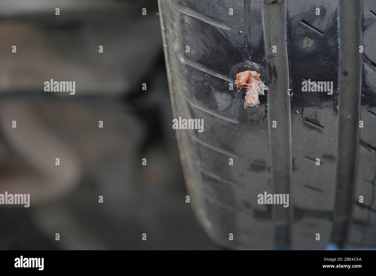 Close-up of a tire that has been repaired with a tire repair kit Stock ...