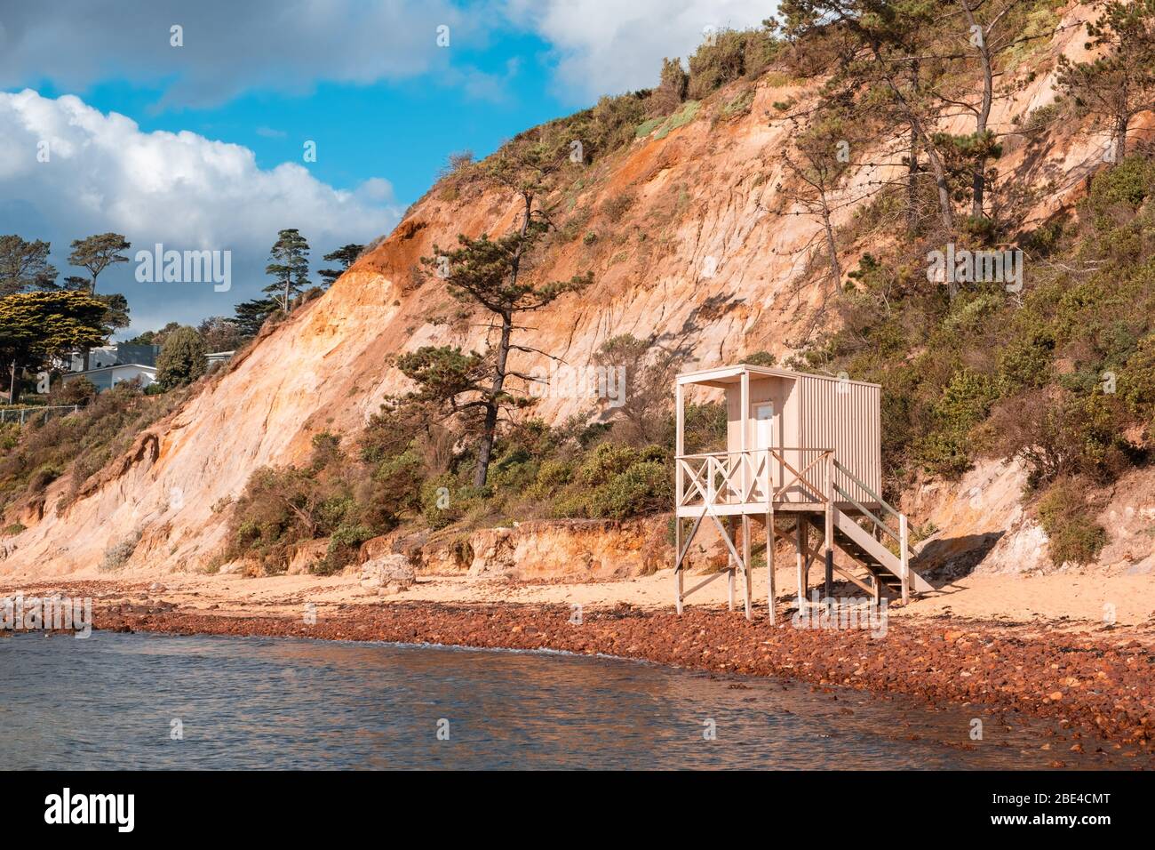 Wooden shack below cliff near the ocean in Australia Stock Photo - Alamy