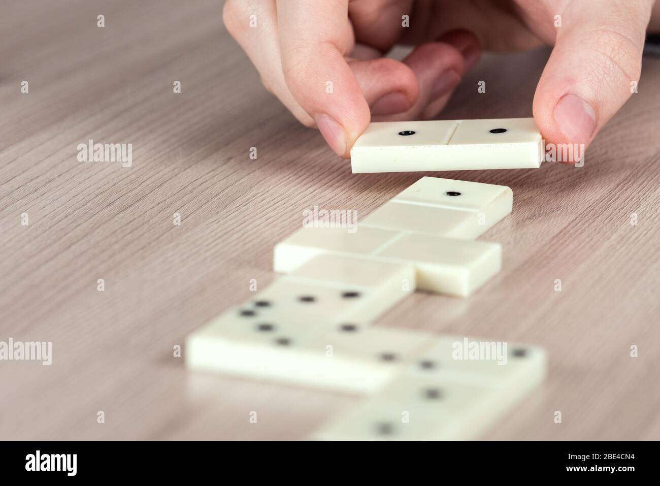 Person playing dominoes on hi-res stock photography and images - Alamy