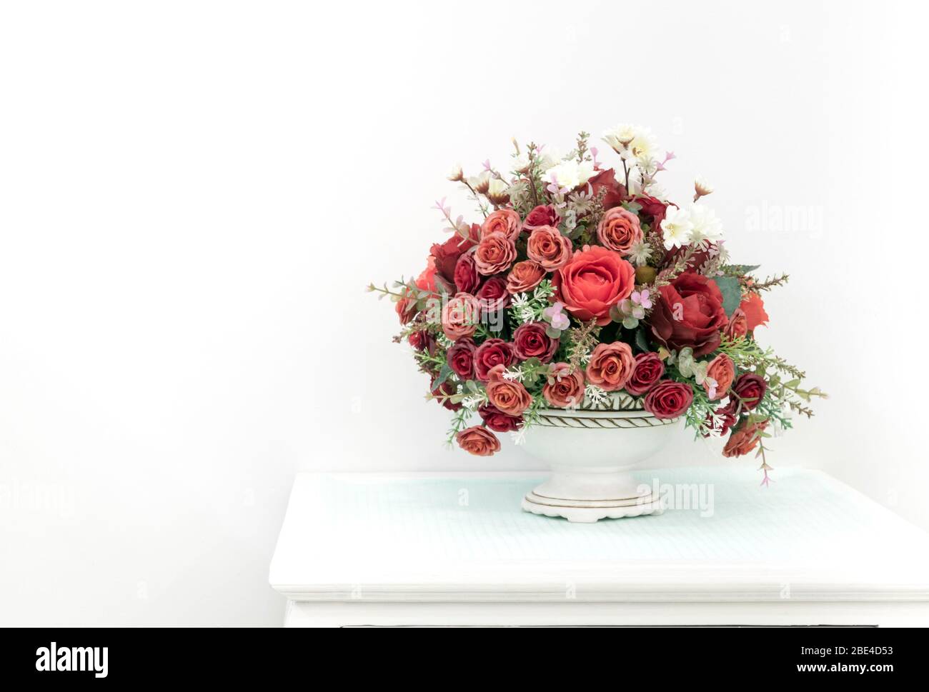 Fabric / Plastic roses in artificial flower bouquet Stock Photo - Alamy