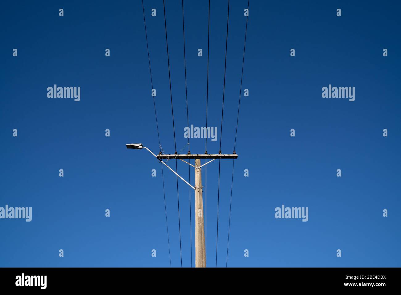 Under electric pole with clear blue sky at Oamaru, New Zealand Stock ...