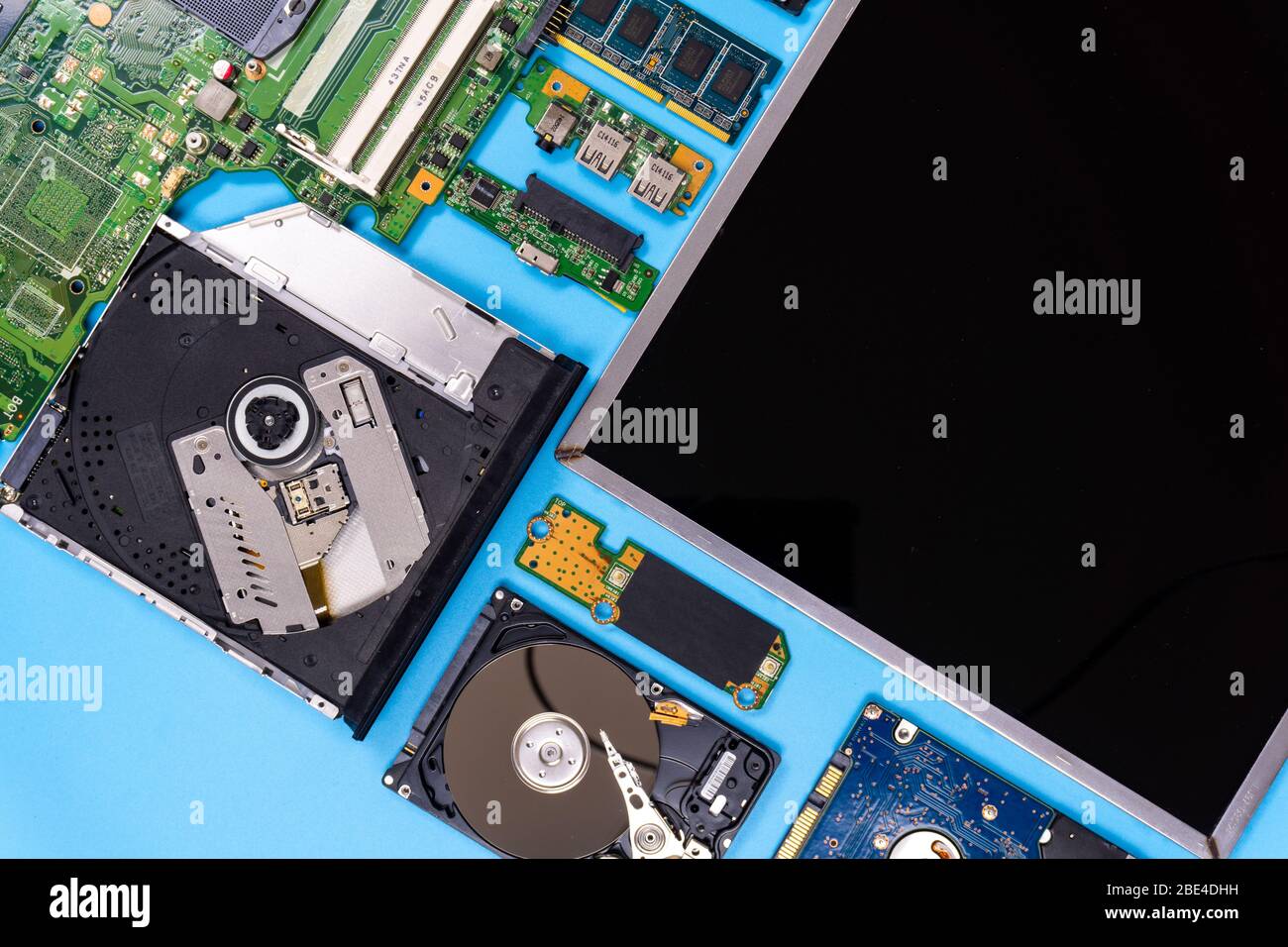 Parts of a modern computer. The insides of a laptop on a blue ...