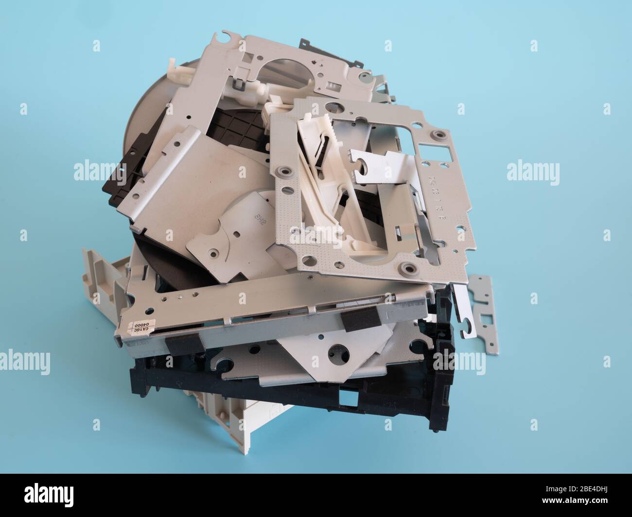 Old disassembled computer DVD drive for recycle on blue background ...