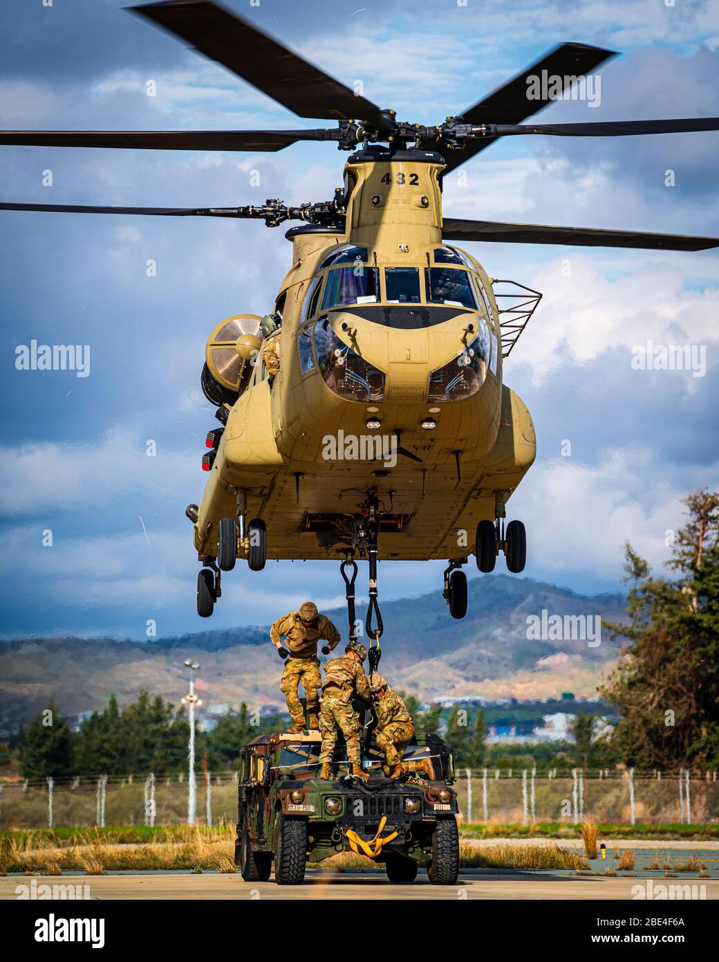 Soldiers of the 173rd Airborne Brigade hook an up-armored HMMWV to a CH ...