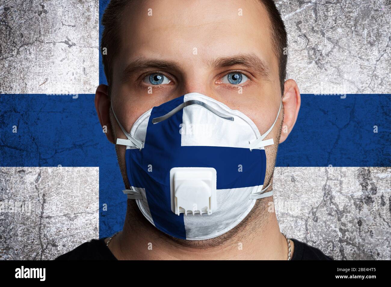 Young man with sore eyes in a medical mask painted in the colors of the ...