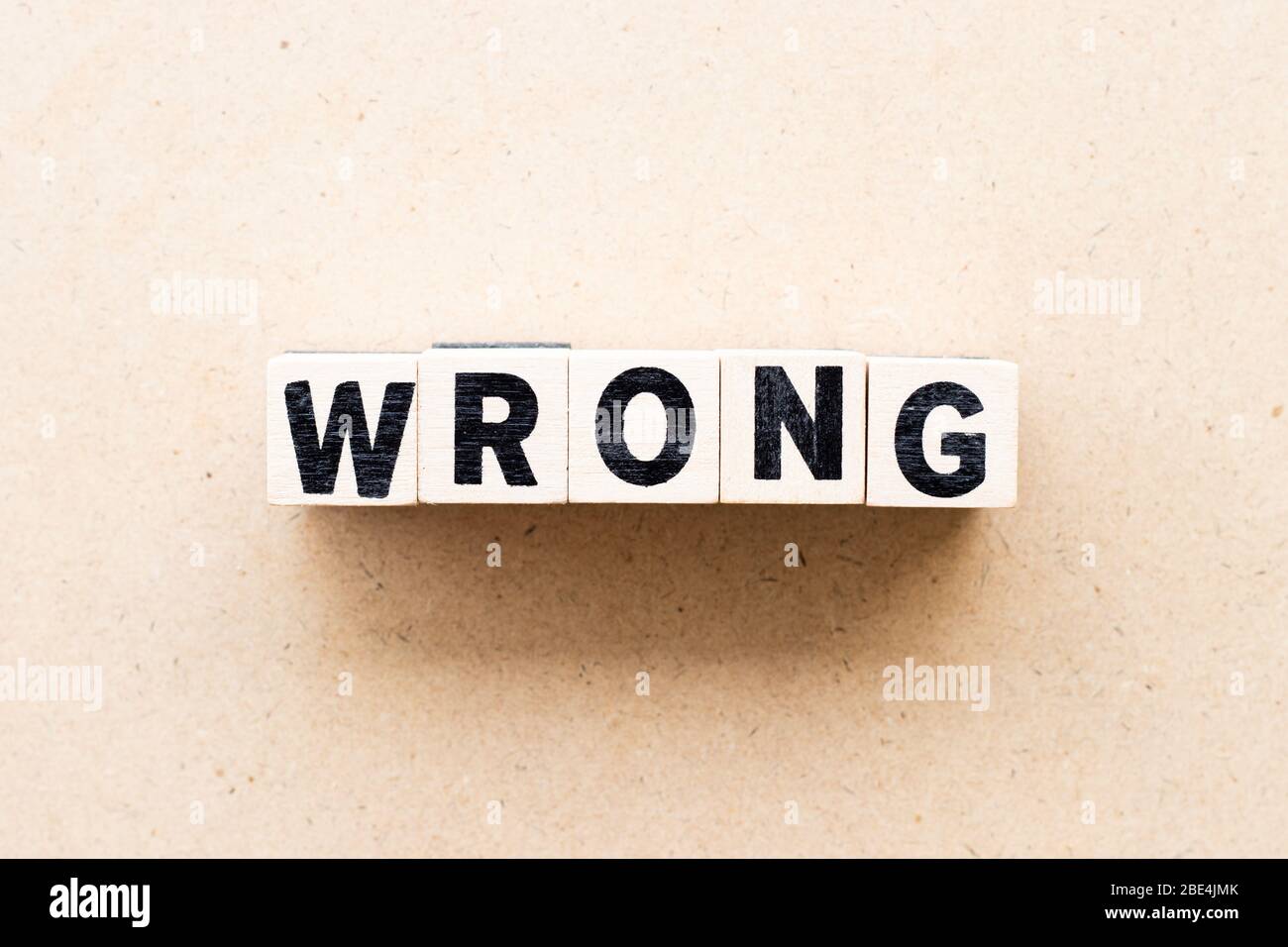 Letter block in word wrong on wood background Stock Photo - Alamy