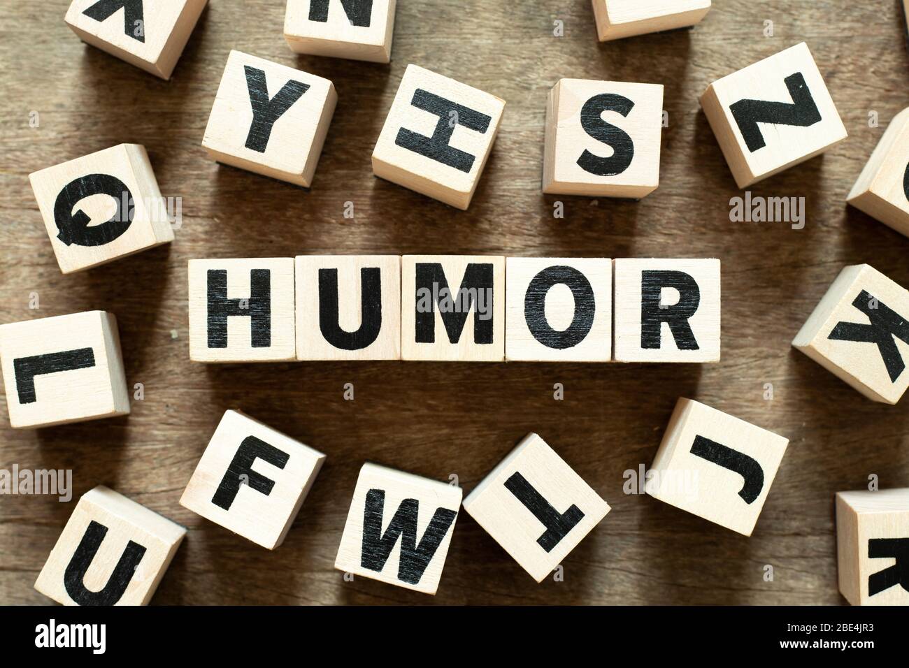 Letter block in word humor with another block on wood background Stock ...