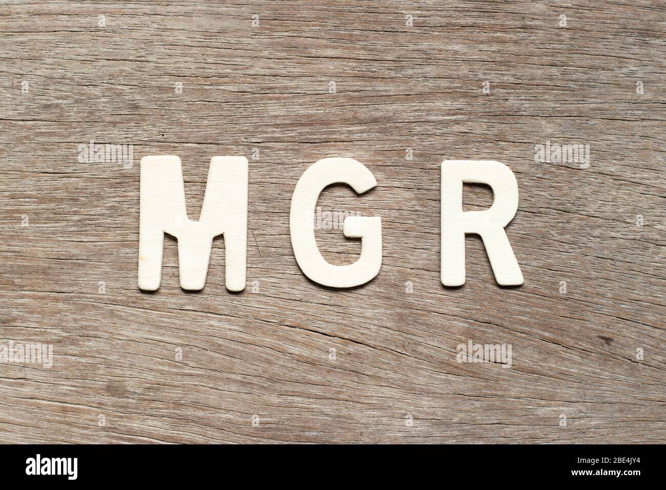 Alphabet letter in word mgr (abbreviation of manager) on wood ...