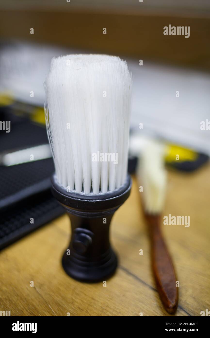 Hairdresser brush for sweeping hair Stock Photo - Alamy