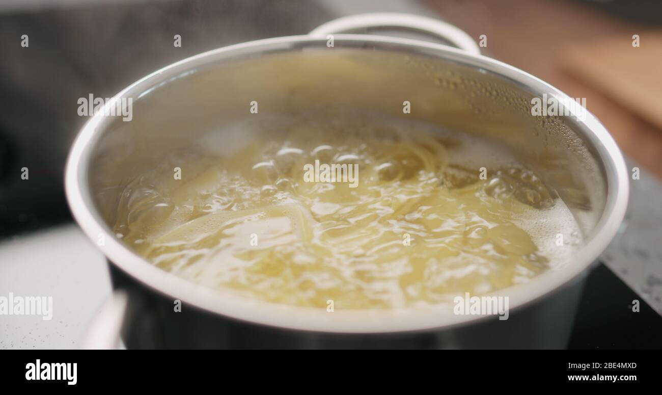 tagliatelle in boiling water closeup Stock Photo - Alamy