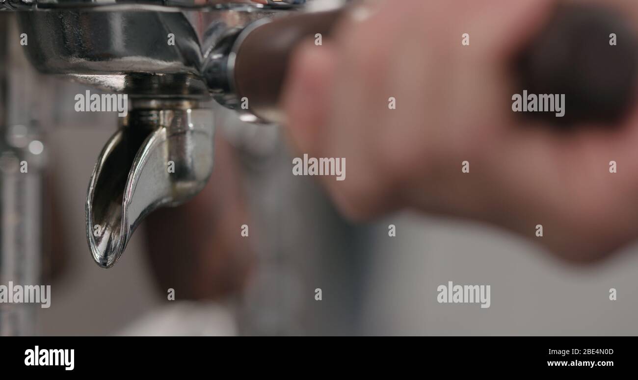 inserting single spout portafilter into coffee machine Stock Photo - Alamy