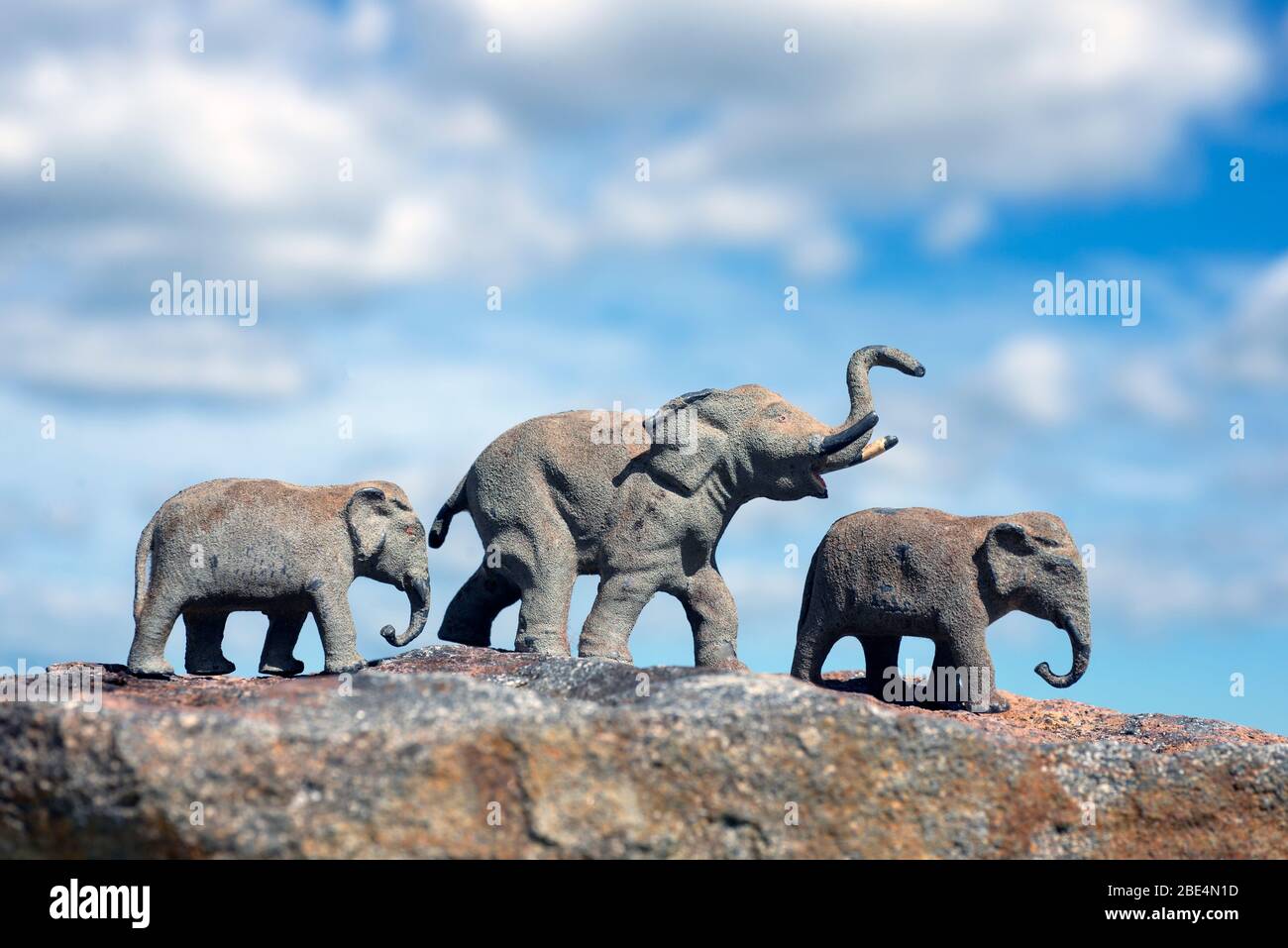 Model elephant family group.Mother and 2 younger elephants Stock Photo ...