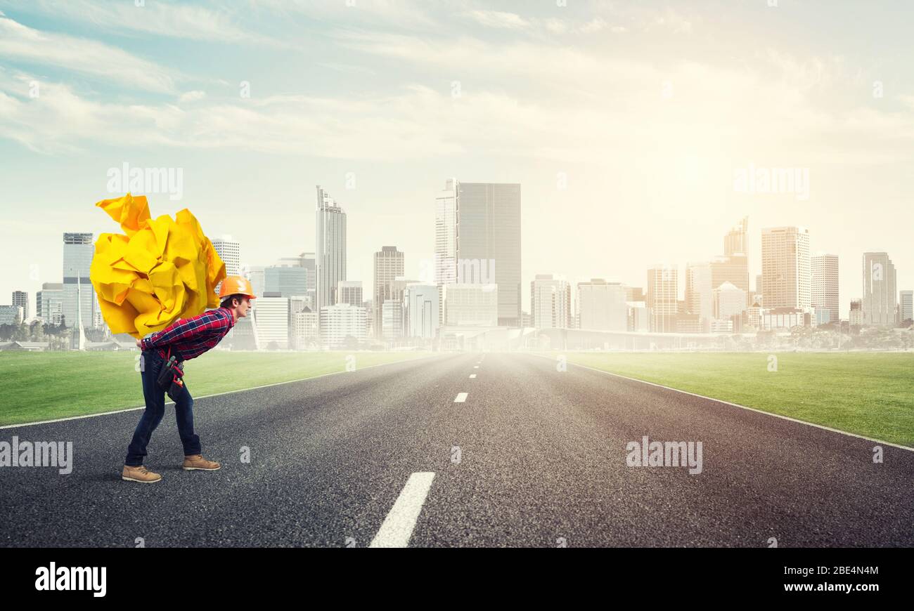 Engineer man carry load Stock Photo - Alamy