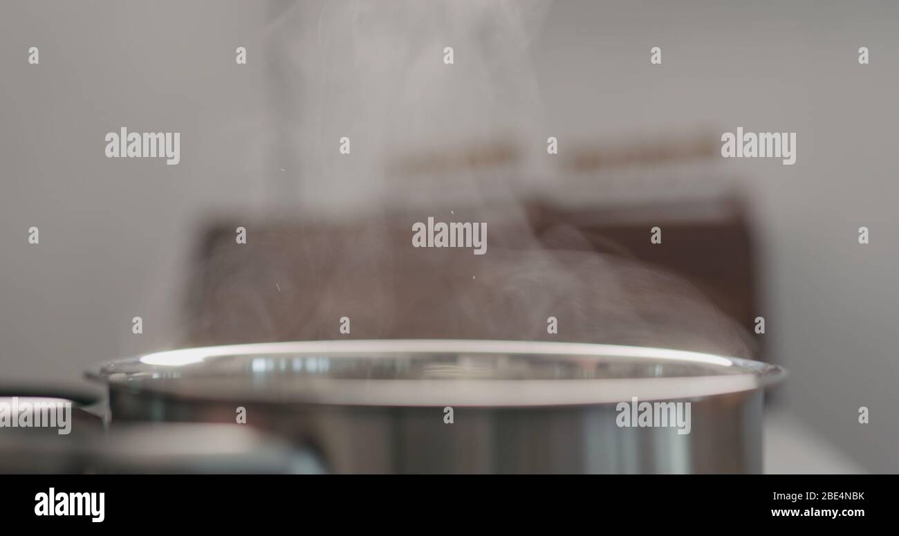 steam rising from pot while cooking Stock Photo - Alamy