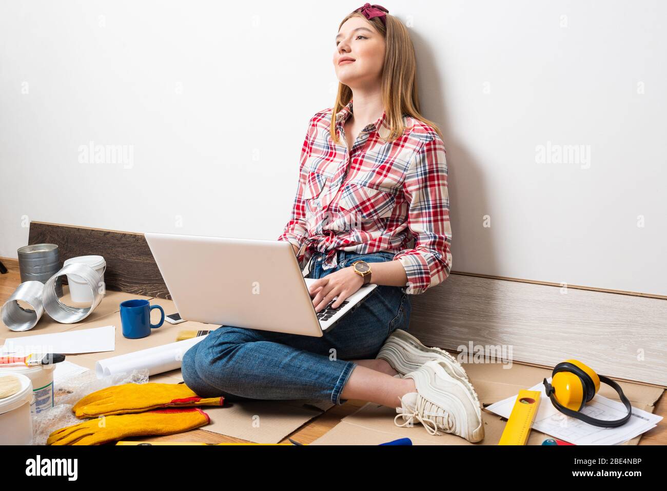 Beautiful girl using laptop computer at home Stock Photo - Alamy