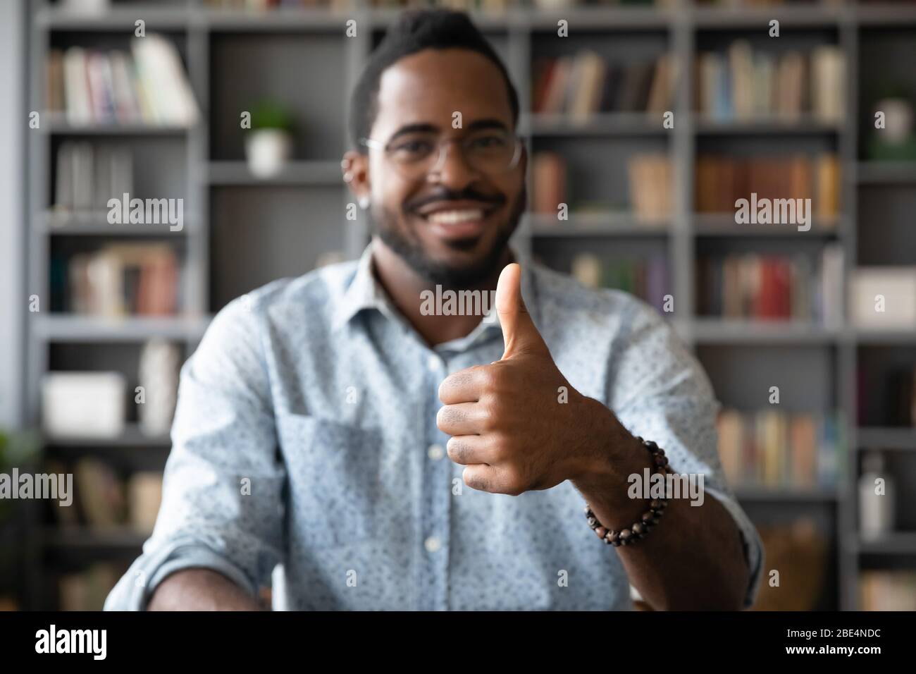 Head shot focus on thumbs up gesture, good clients recommendation Stock ...