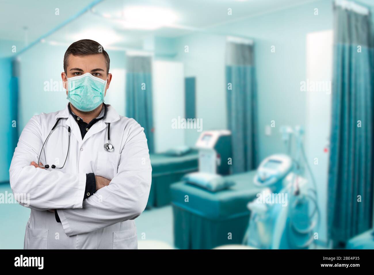 Caucasian man posing as a medical doctor in white overall or scrub with ...