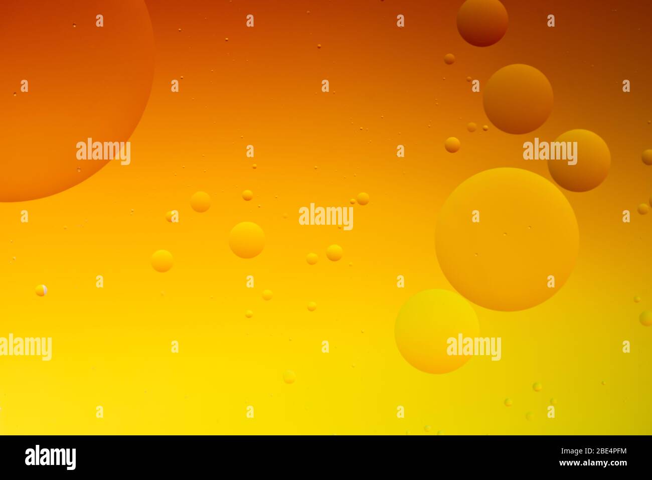 Bright abstract, yellow background with flying bubbles and copy space ...
