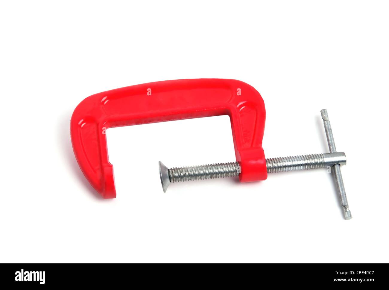 metal clamp red close up on a white background isolate Stock Photo - Alamy
