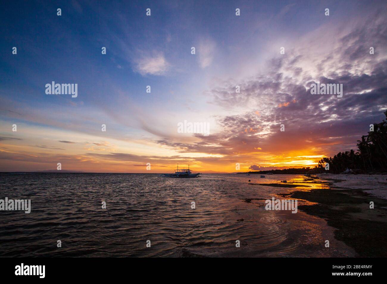 Beautiful sunset at a beach in Bohol Island, Phillippines Stock Photo ...
