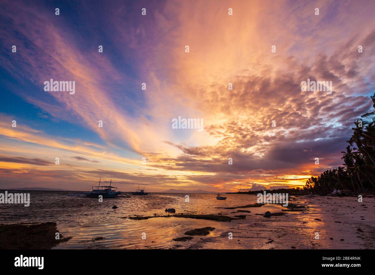 Beautiful sunset at a beach in Bohol Island, Phillippines Stock Photo ...