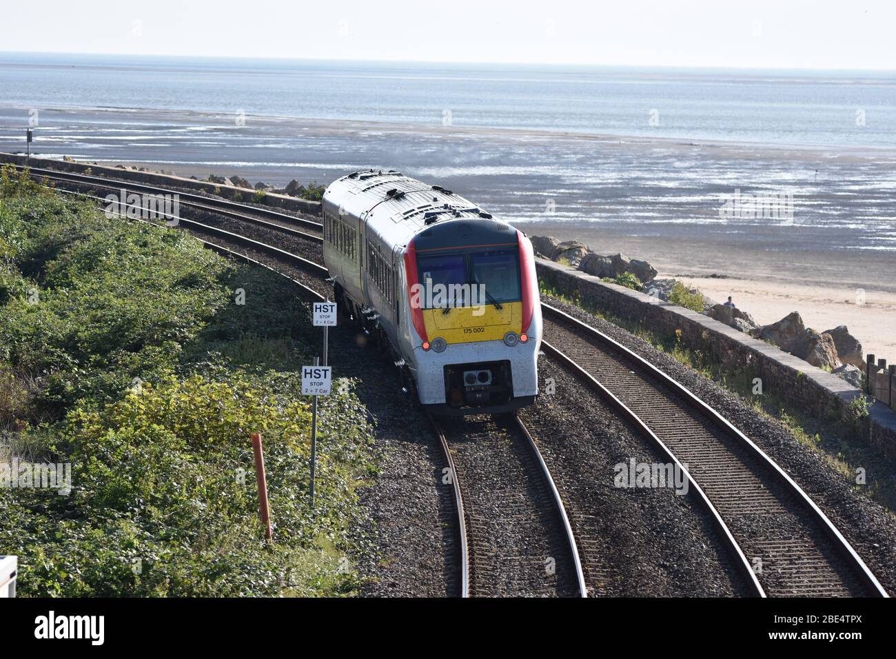 A photo of a small train taken from the bridge at Ferryside railway ...