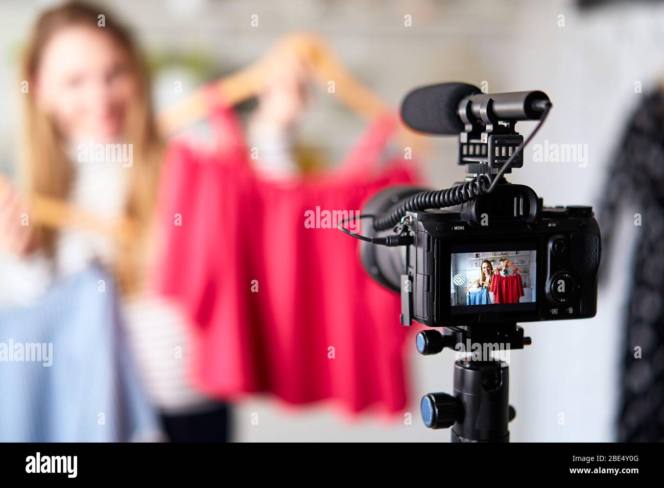 Fashion blogger woman in jeans and turtleneck showing casual colorful ...