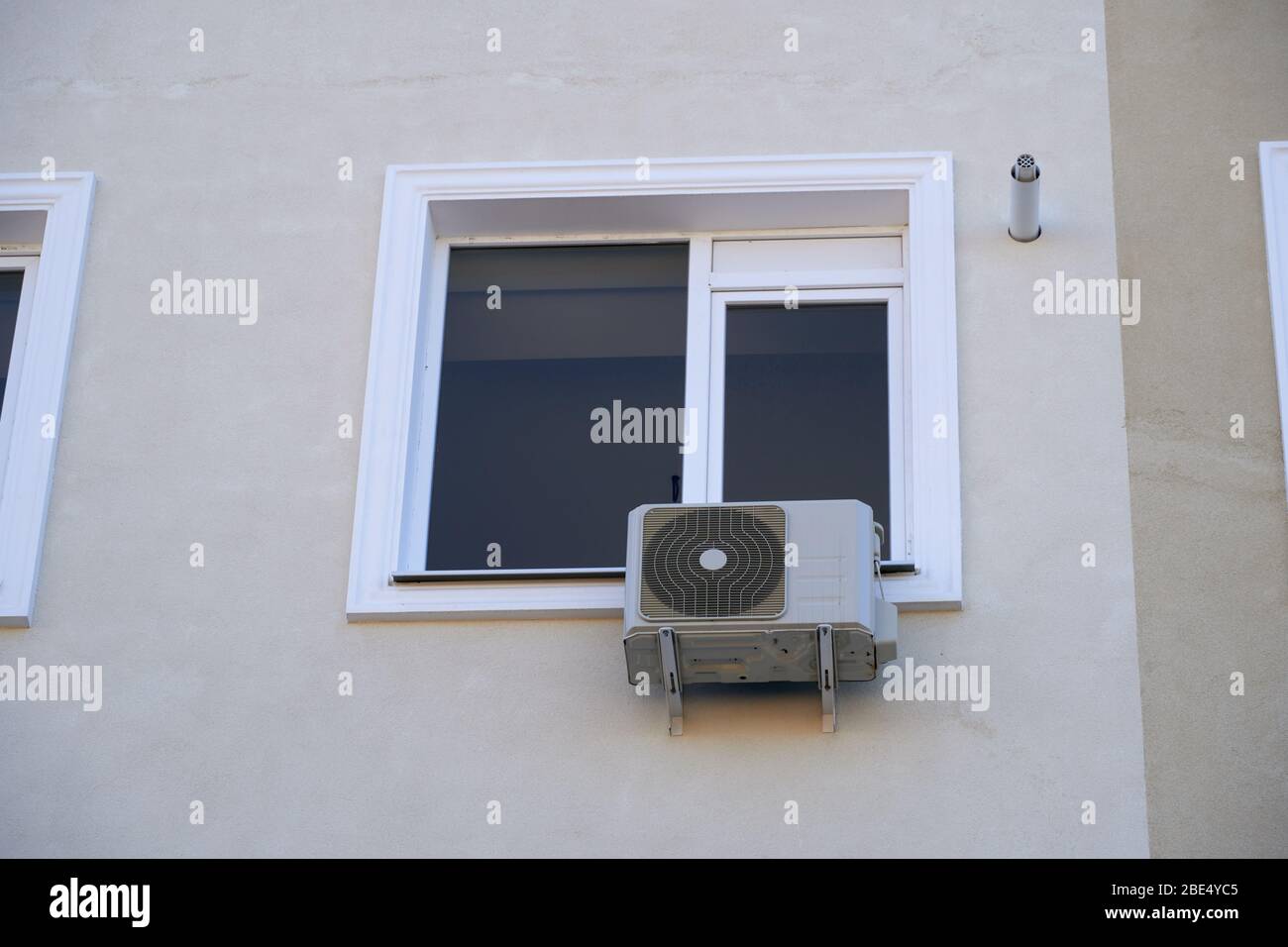 one air conditioner outside unit on a facade of residential building ...