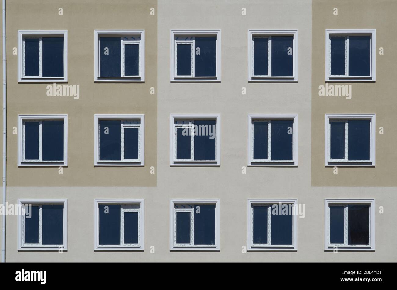 facade of a new multi-storey building with many windows Stock Photo - Alamy