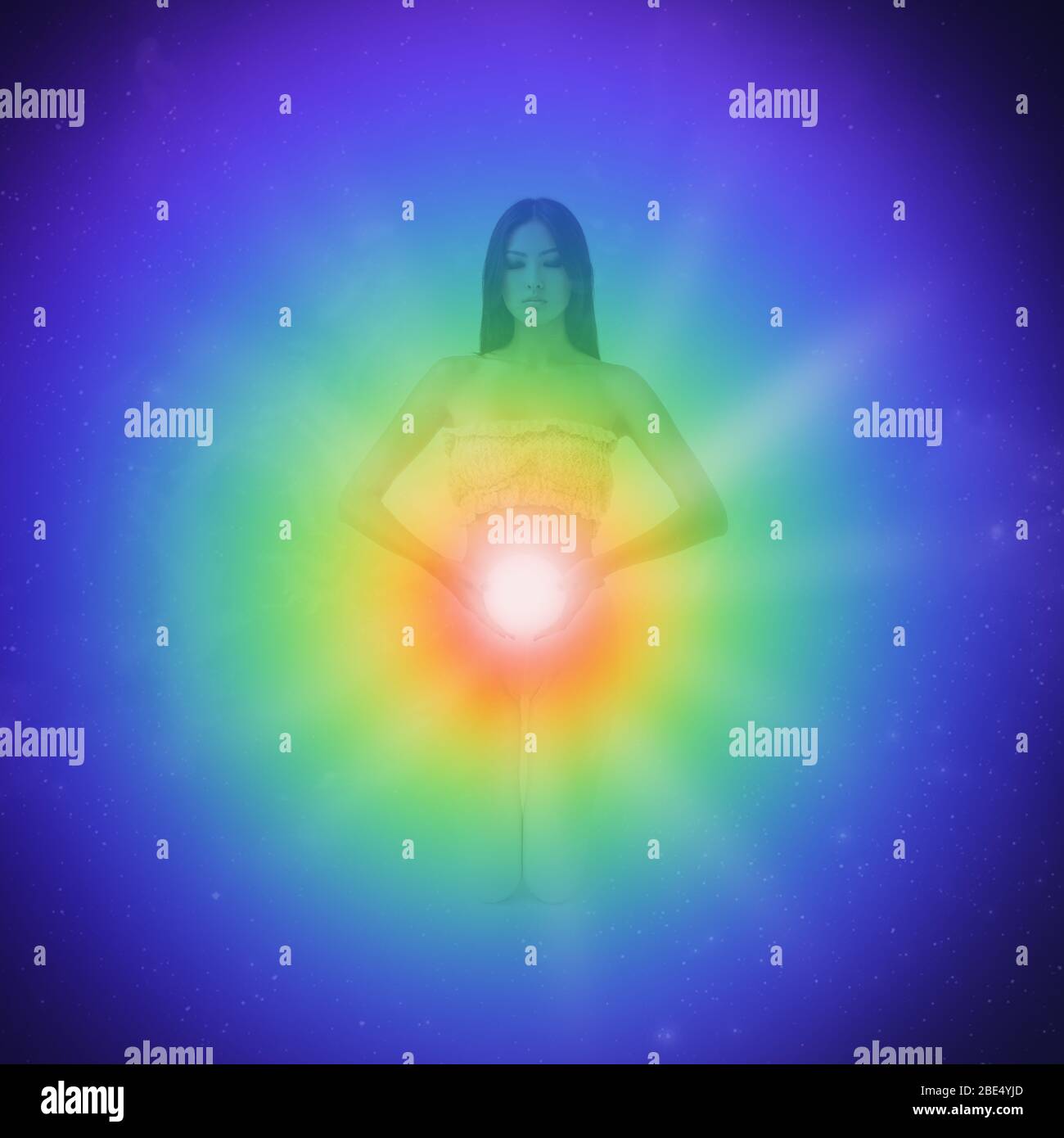 Chakras meditating woman over rainbow hi-res stock photography and ...