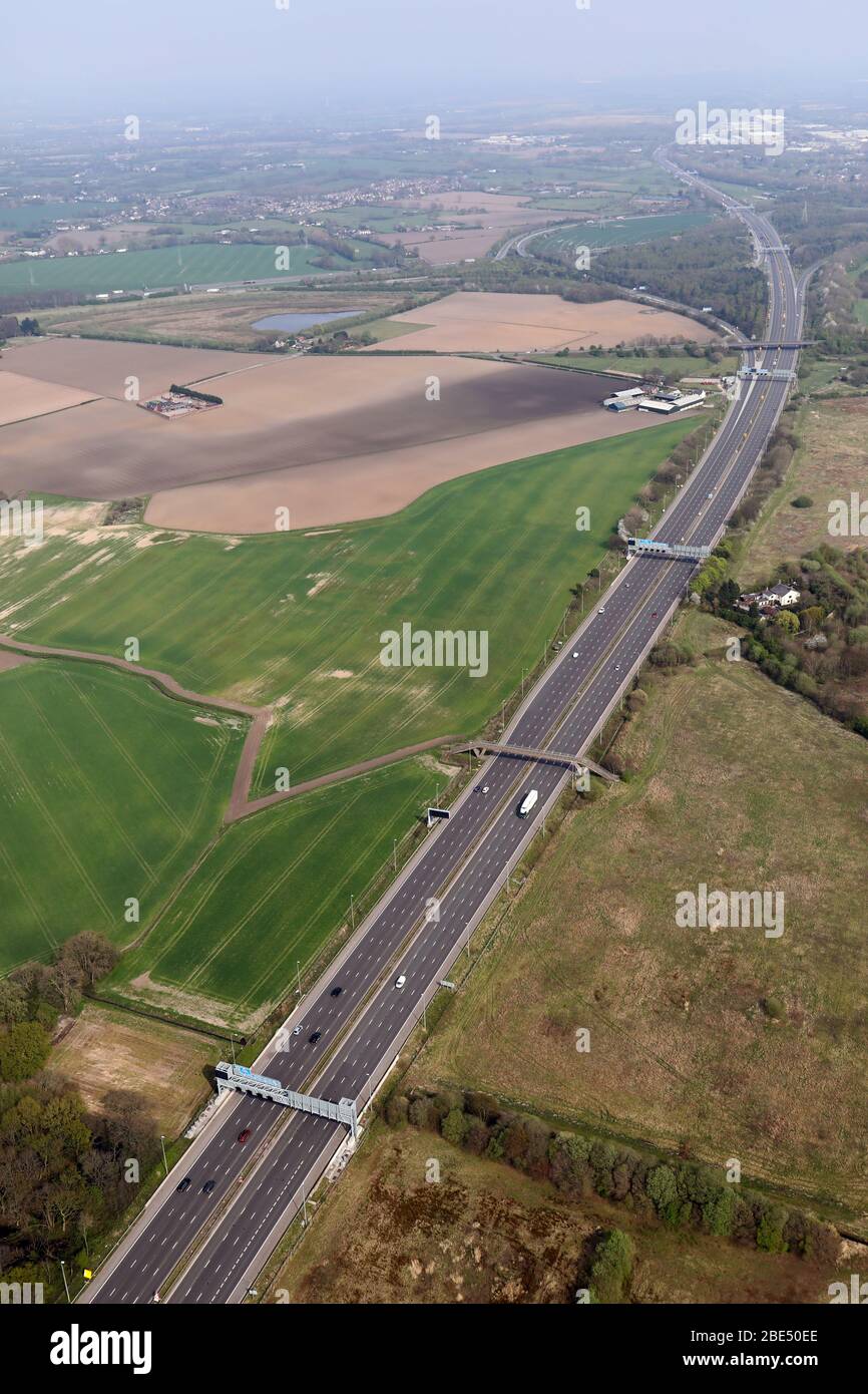 aerial view of an empty M62 motorway looking east towards junction 21a ...